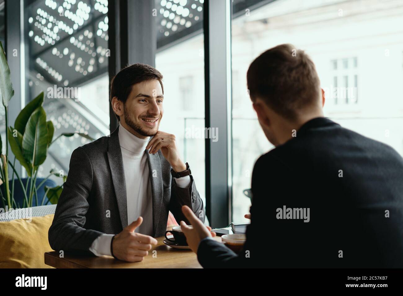 Businessman thinking during a meeting hi-res stock photography and ...
