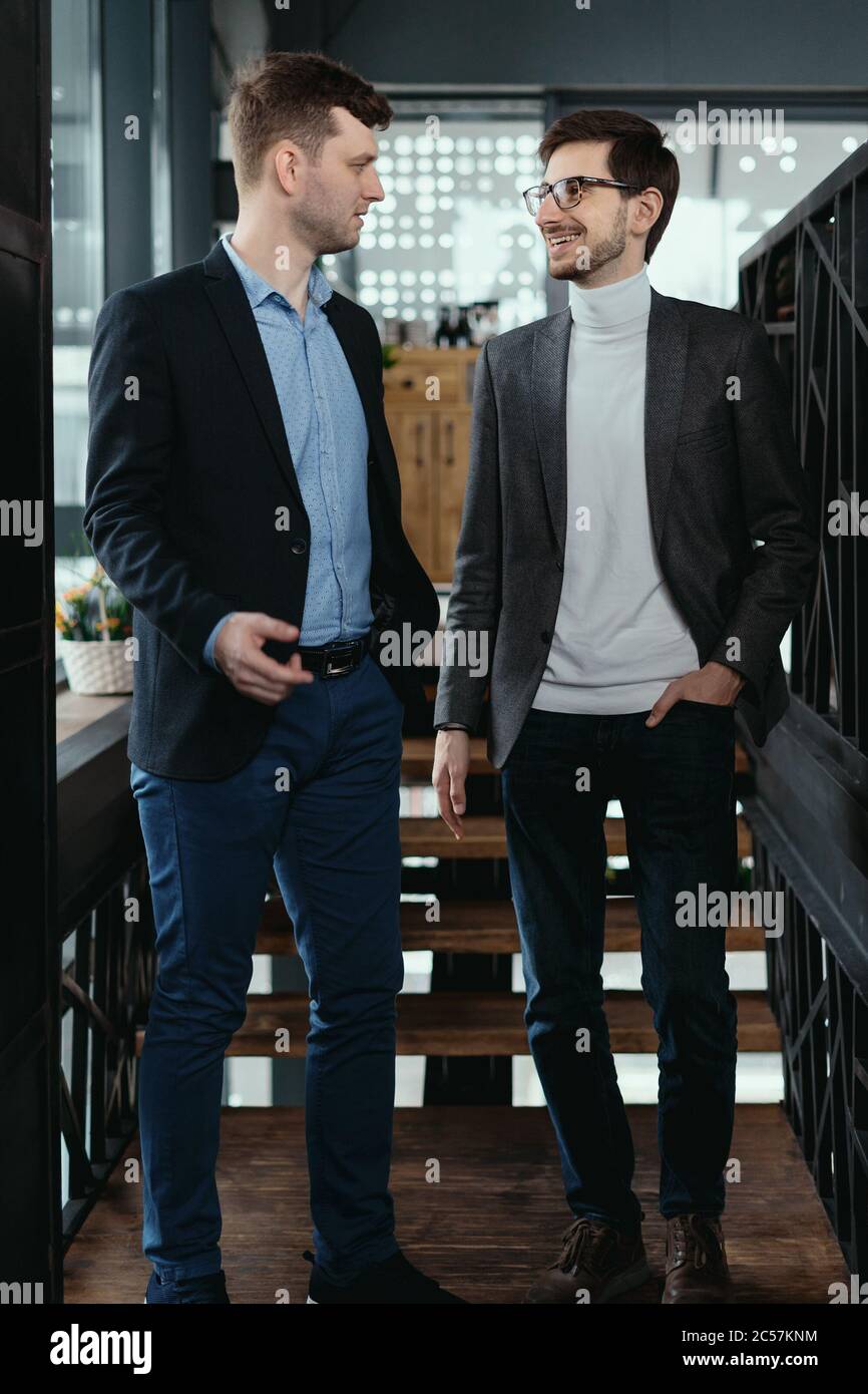 Businessmen walking down stairs hi-res stock photography and images - Alamy