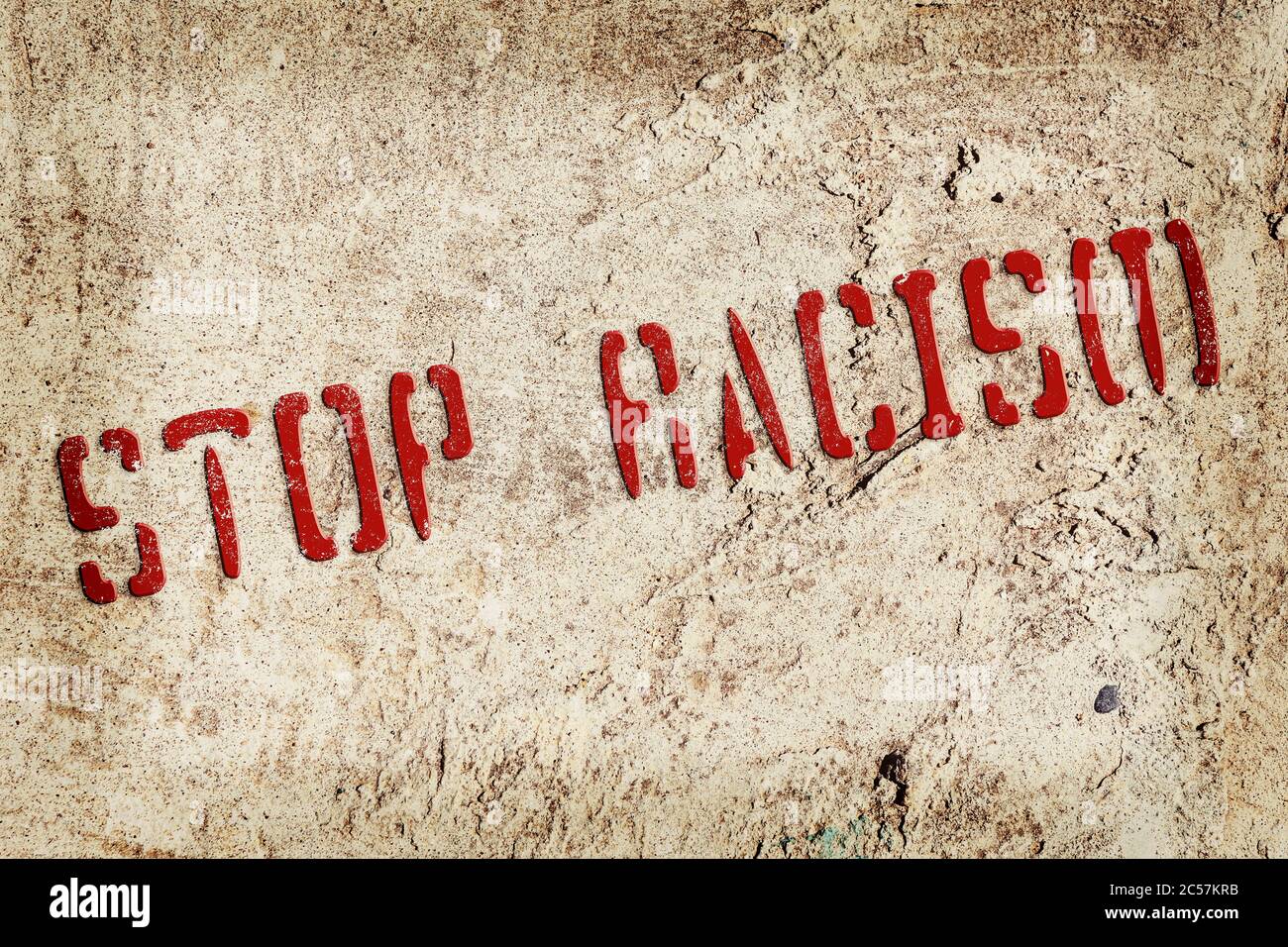 Stencil stop racism on an old concrete wall. Background. Collage ...