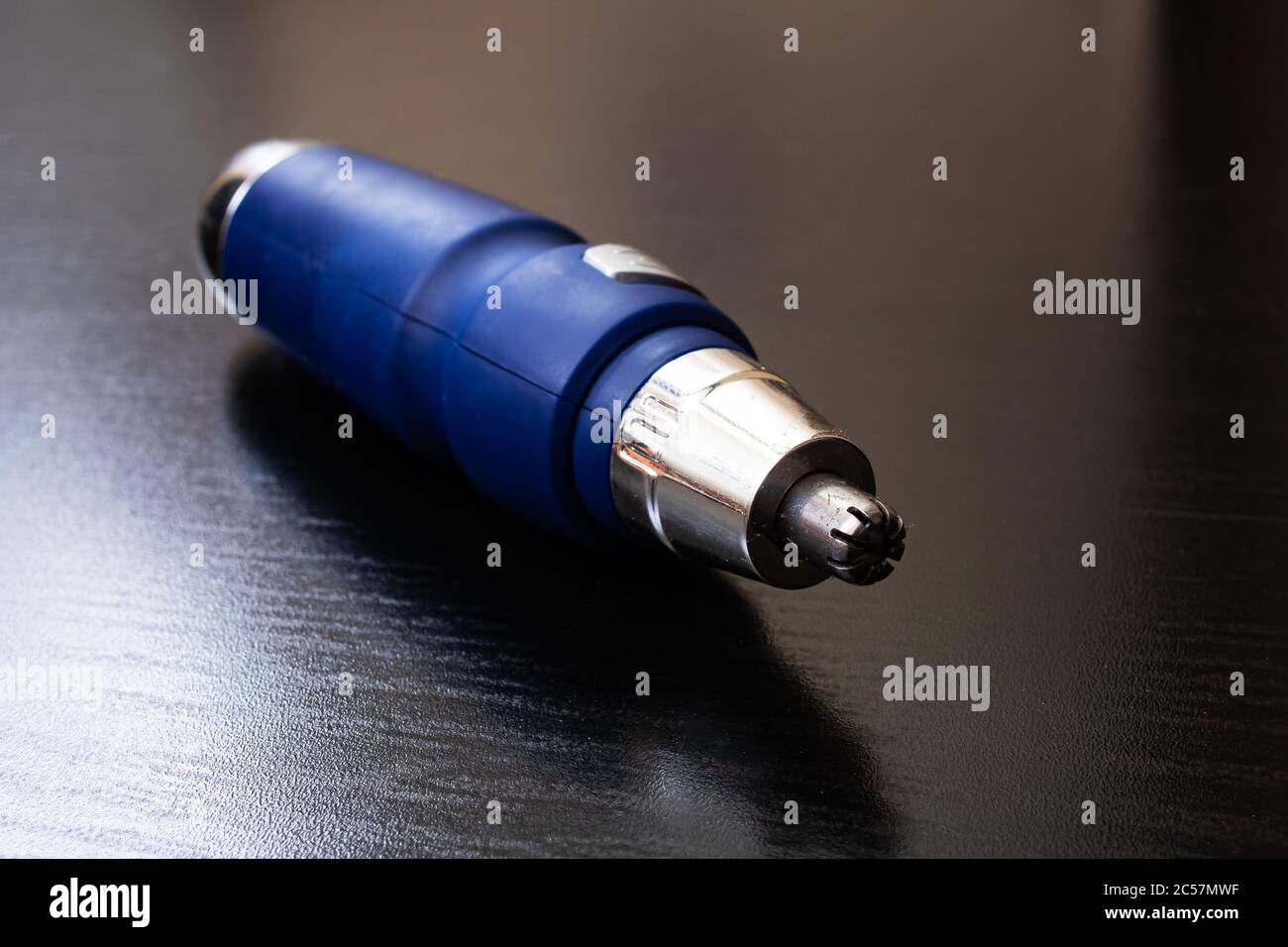 Trimmer for hair on a wooden table close up Stock Photo - Alamy