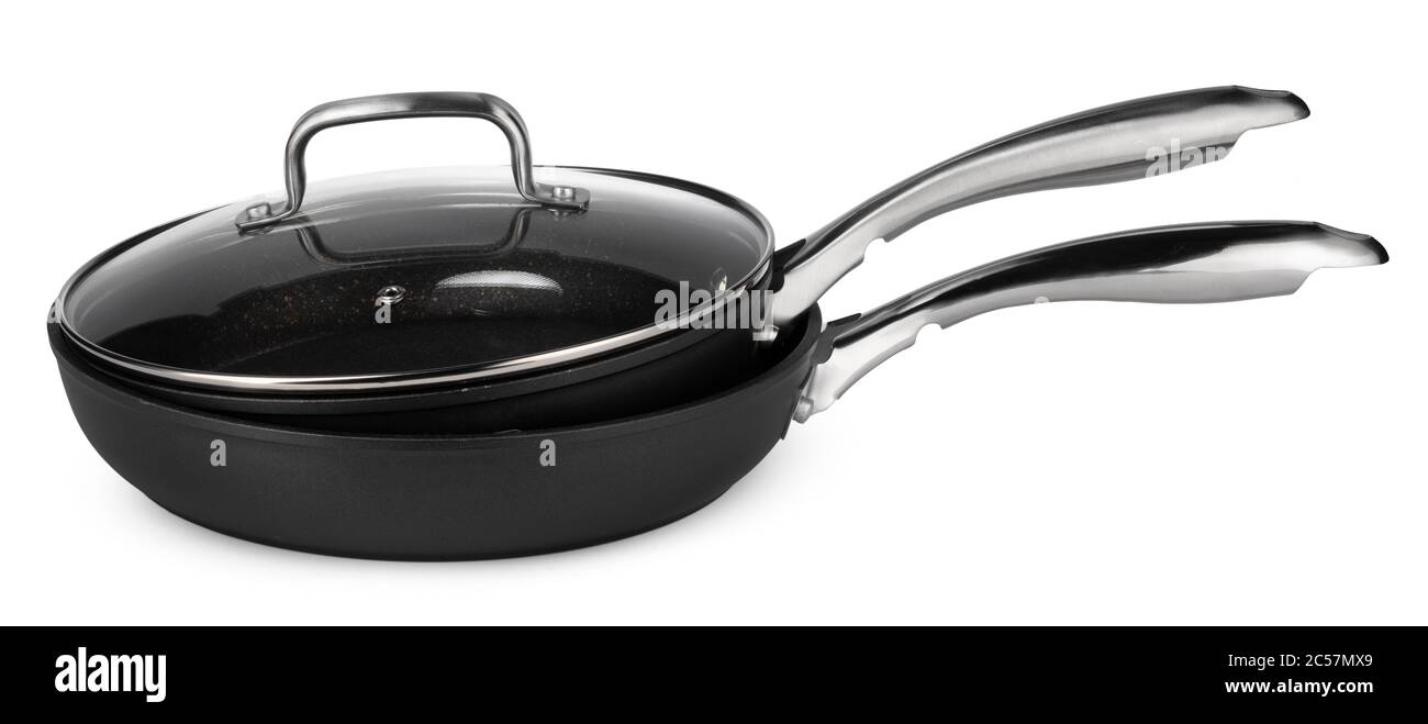 Set of new black pans isolated on white Stock Photo - Alamy