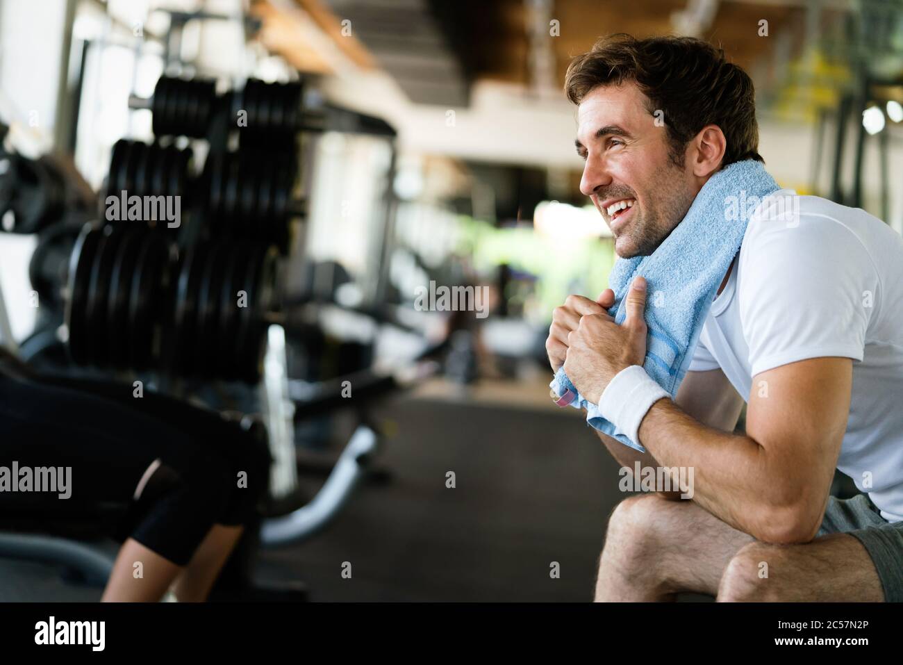 Lifestyle portrait of handsome muscular man after the training in the ...