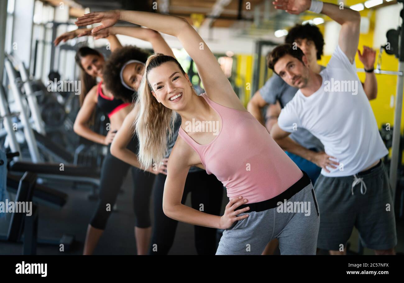 Group of fit people at the gym exercising Stock Photo - Alamy