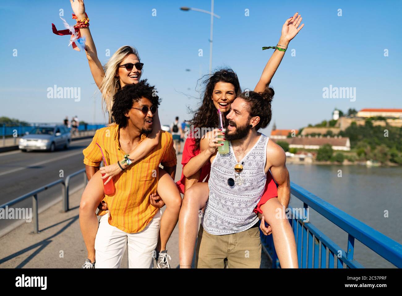 Happy friends laughing and having fun outdoors Stock Photo - Alamy