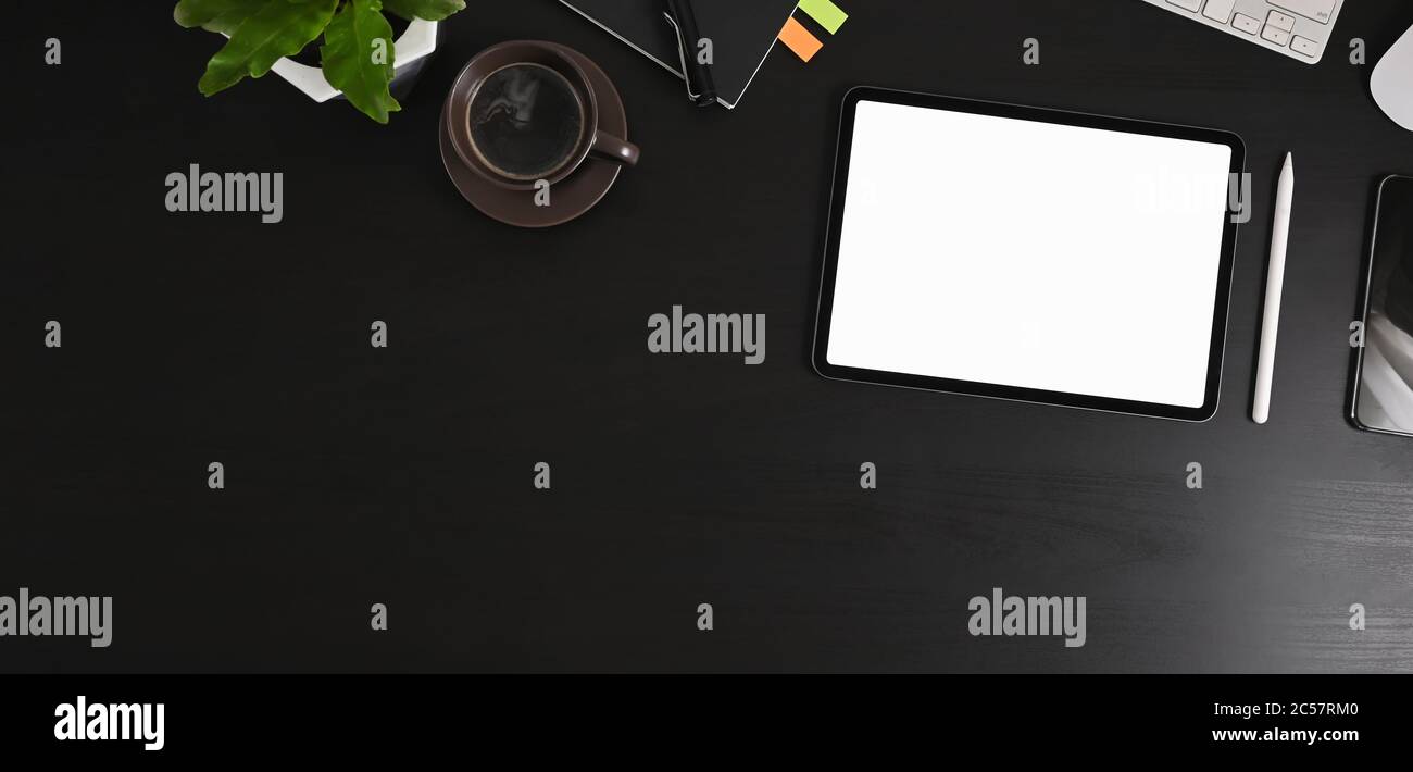 Top view image of white blank screen computer tablet and office ...