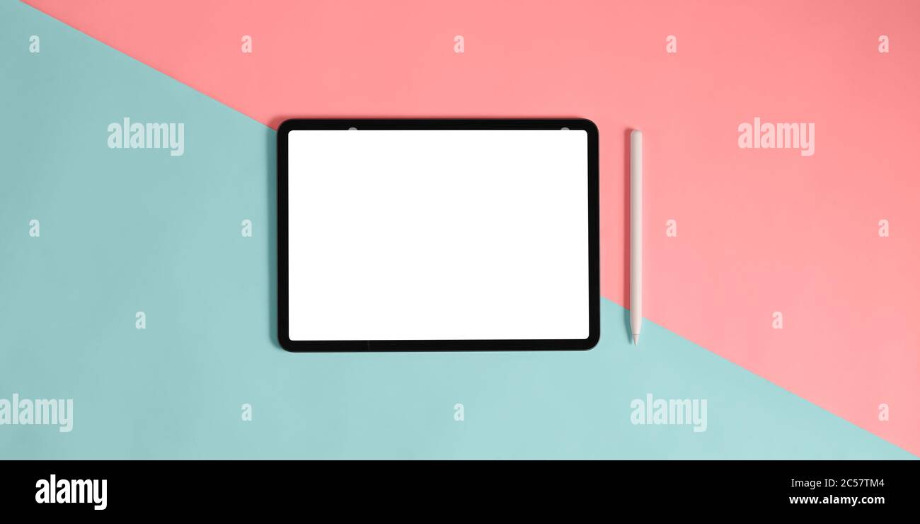 Two tones color workspace is surrounding by white screen tablet and ...