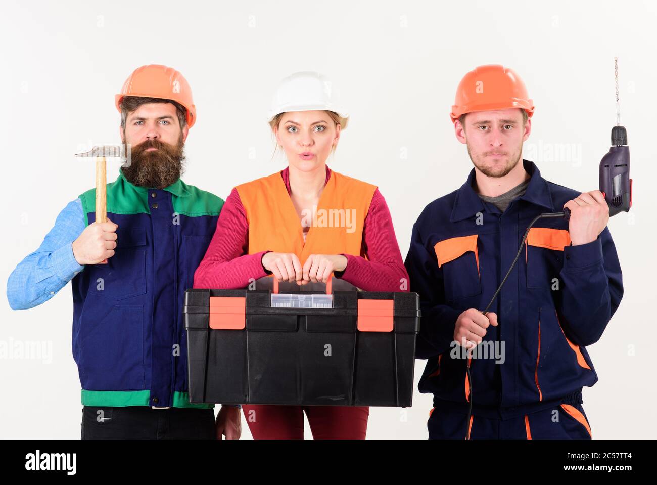 Men and woman in helmets and uniform. Full service concept. Team with ...