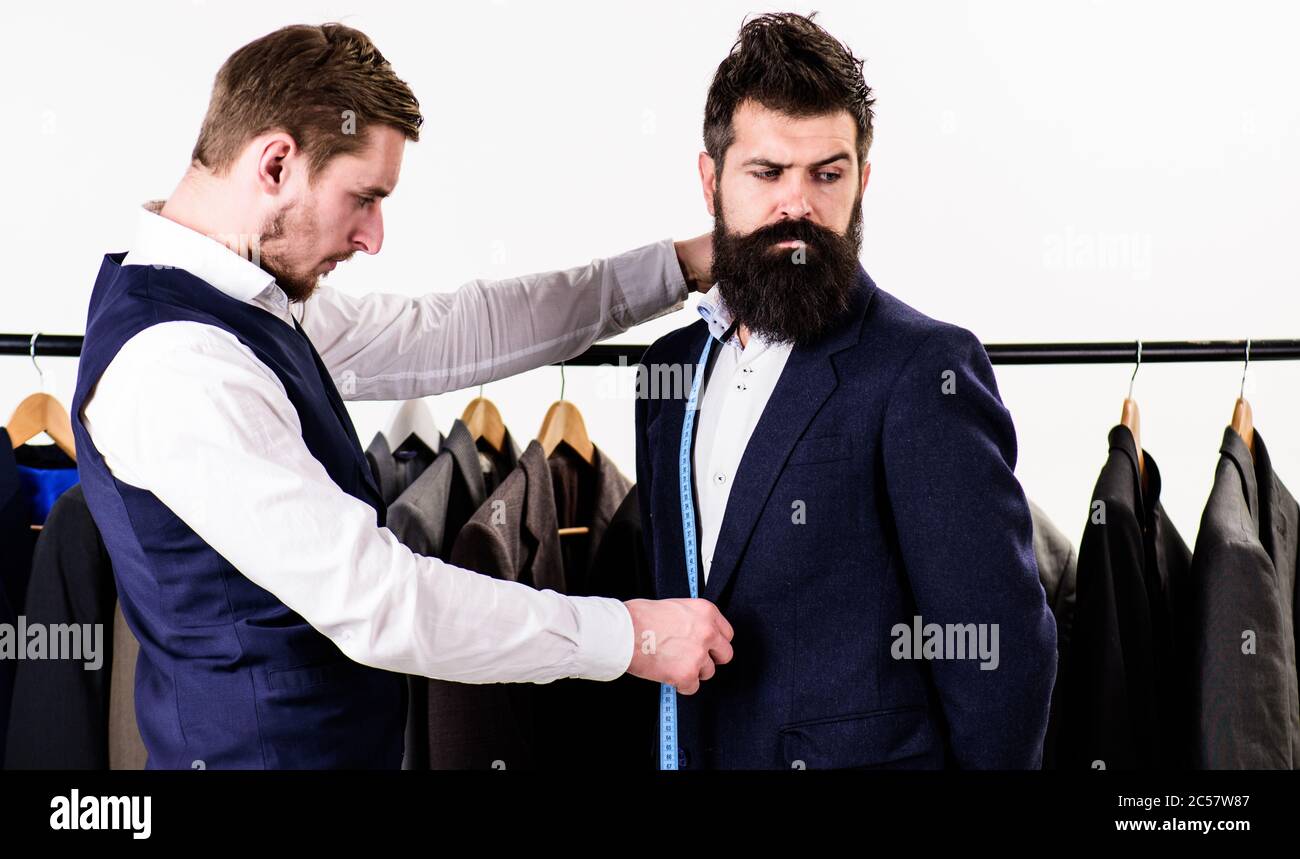 Tailors studio concept. Tailor measure chest for sewing suit, white ...