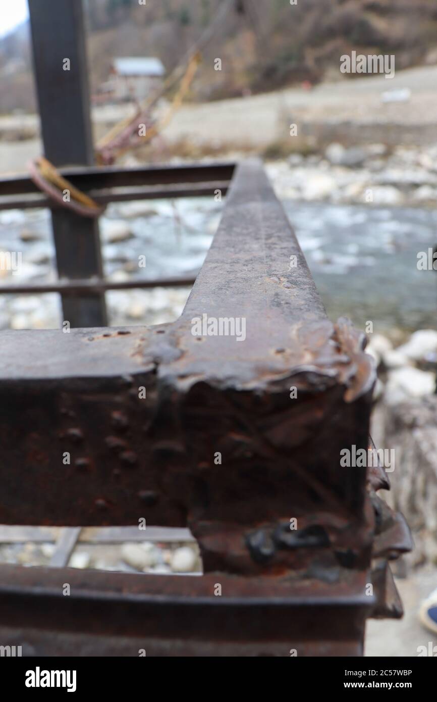 metal rod having flowing river in the background Stock Photo - Alamy