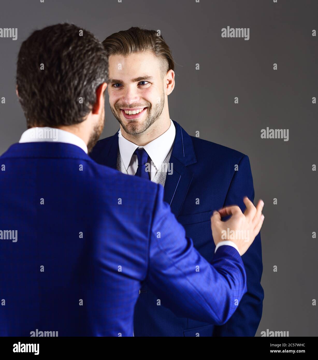 Business negotiations concept. Boss and employee speaking at meeting on ...