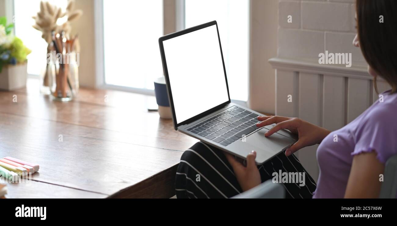 Woman sitting living room floor working from home using laptop hi-res ...
