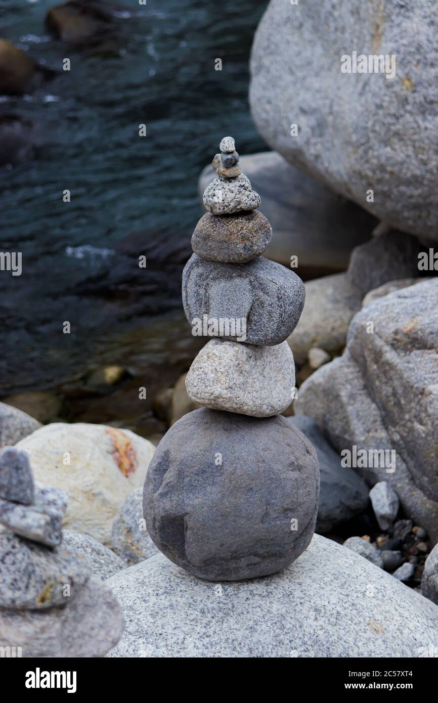 Rock Balancing: Stone Stacking Art having flowing river in the ...