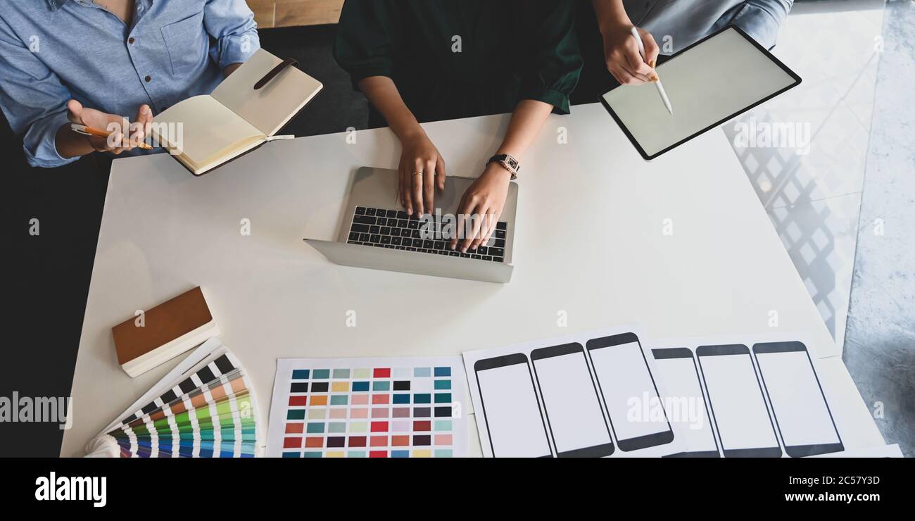 Top view image of graphic designing team working together and ...