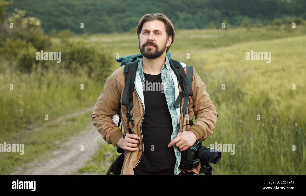 Hiking man enjoying scenery Stock Photo - Alamy