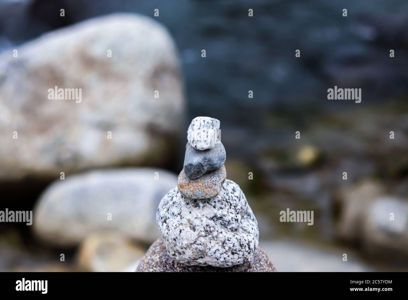 Rock Balancing: Stone Stacking Art having flowing river in the ...