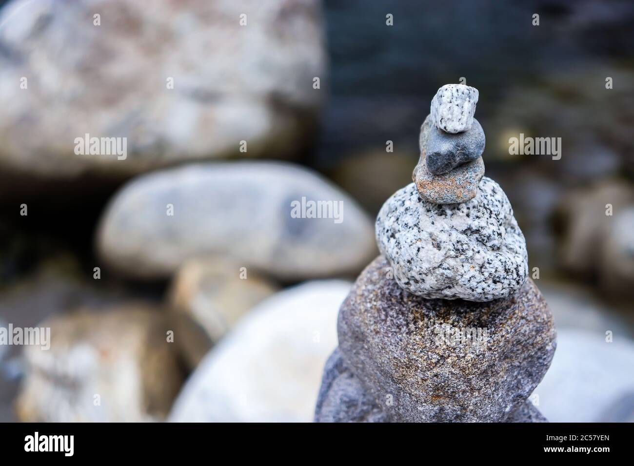 Rock Balancing: Stone Stacking Art having flowing river in the ...