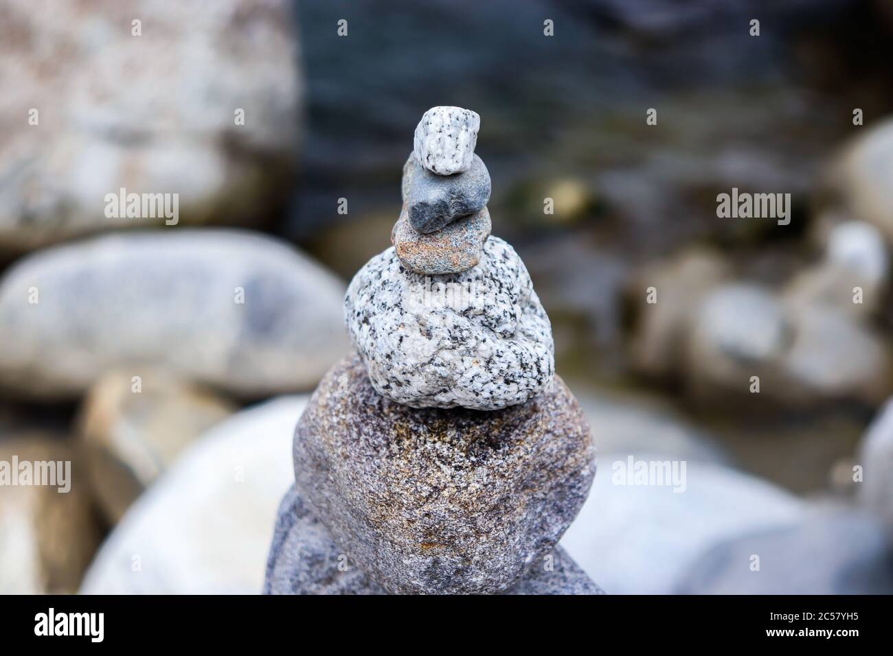 Rock Balancing: Stone Stacking Art having flowing river in the ...