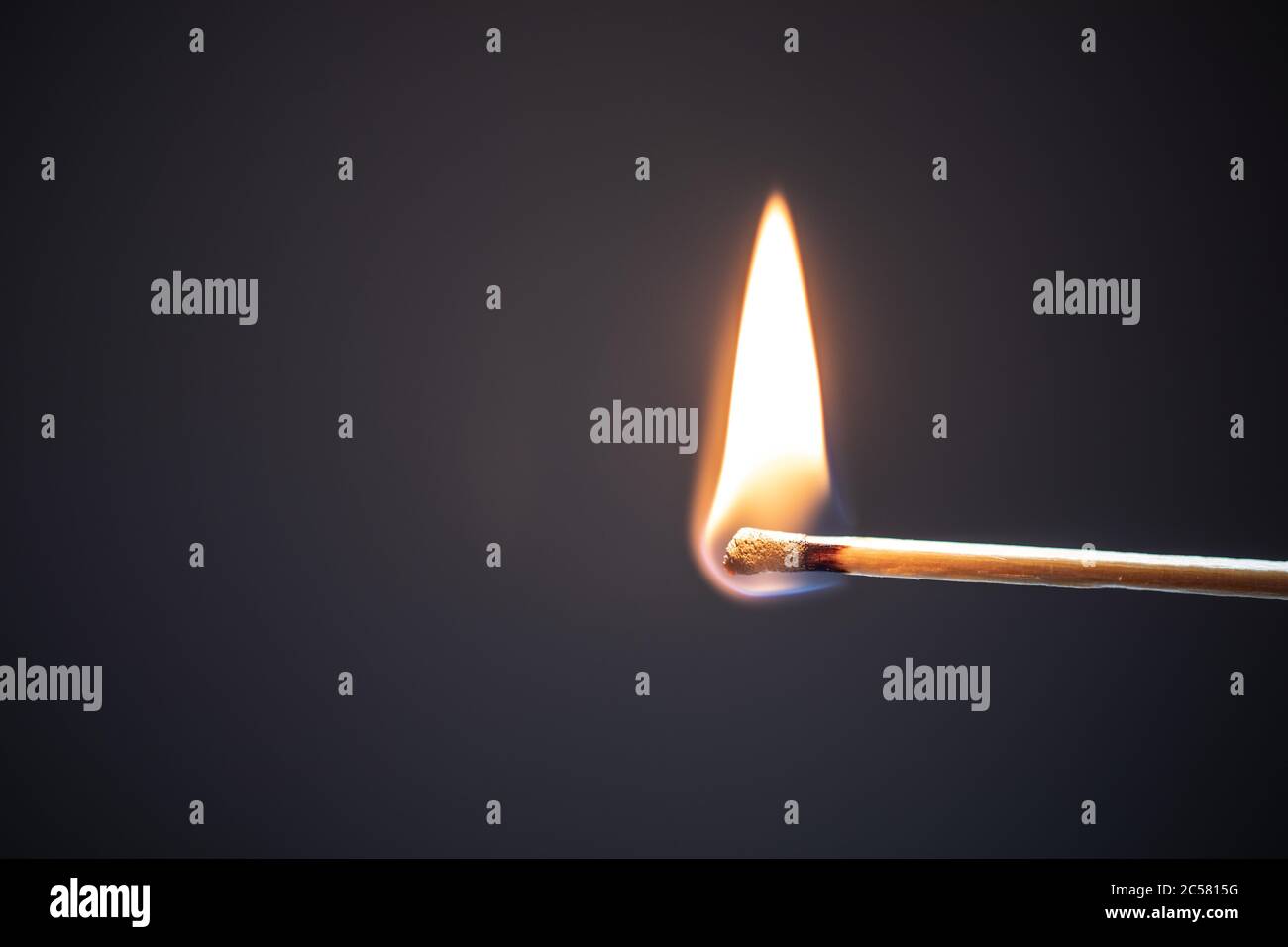 Matchstick burns with a flame and bends upward blackening Stock Photo ...