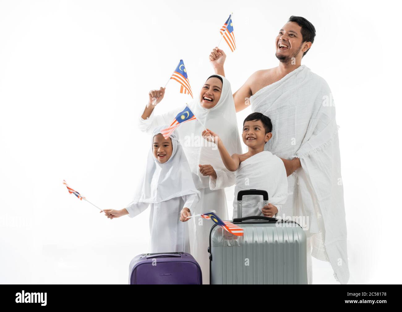 malay family umrah and hajj. happy muslim family with ihram clothing ...