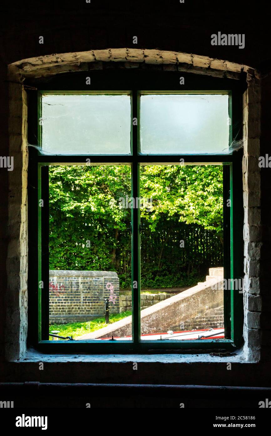 view of canal through old window at Middleport pottery stoke on trent ...