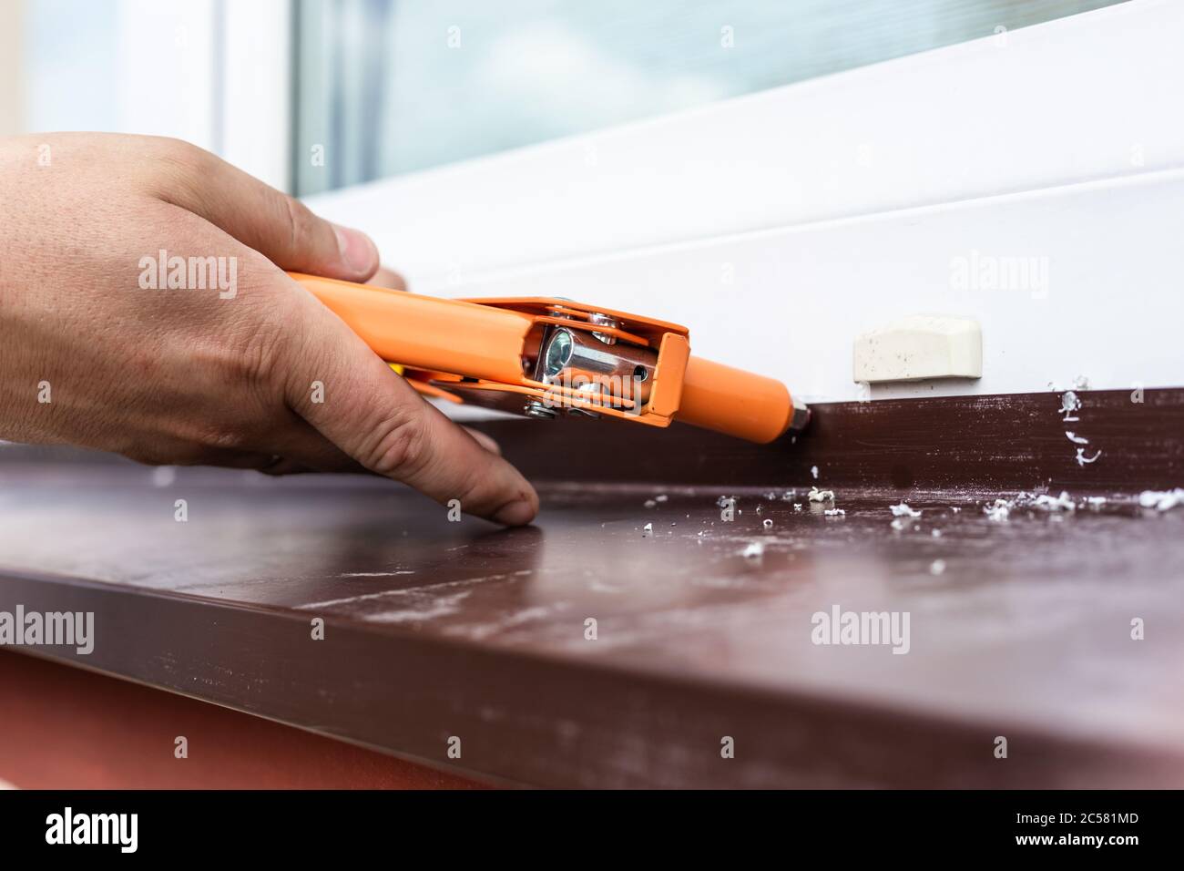 Construction work - installation of rivets. Window tint repair. Plastic ...