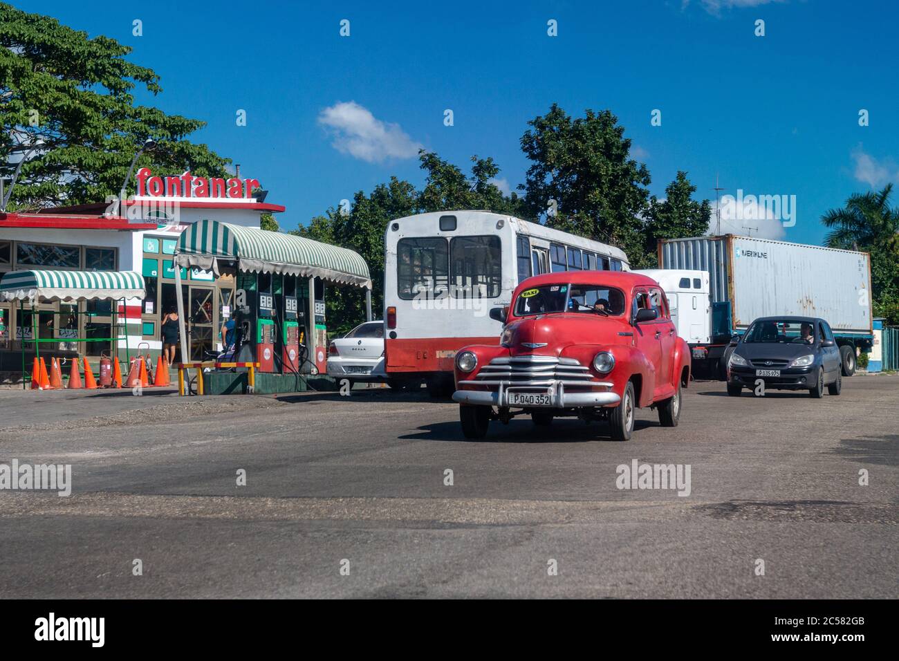 Red vintage car on the track Stock Photo - Alamy