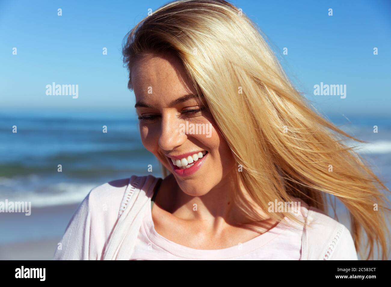 Smiling woman on seaside hi-res stock photography and images - Alamy