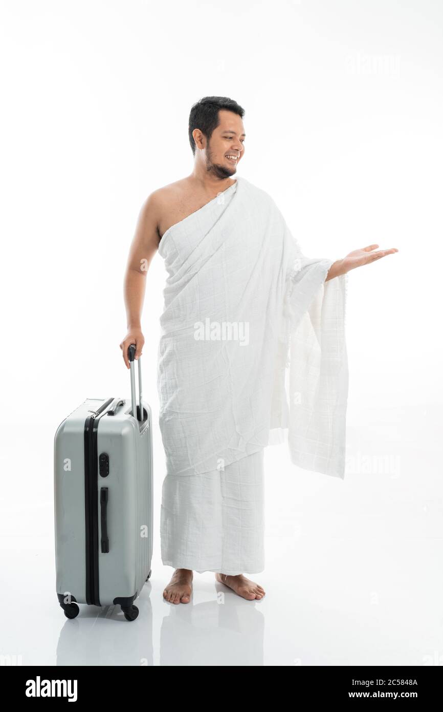 asian male with ihram presenting copyspace. hajj and umrah man concept ...
