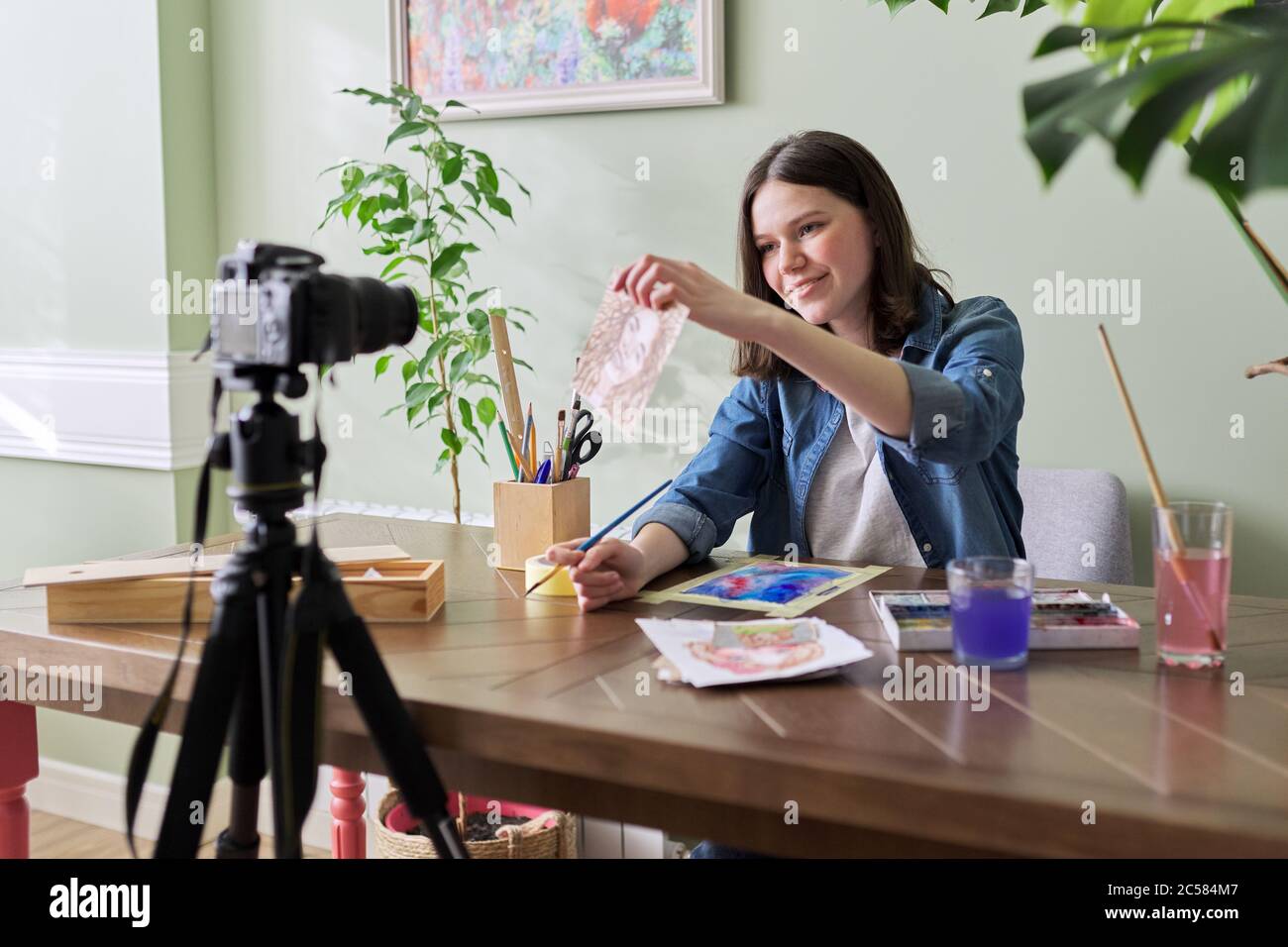 Creative girl teenager artist painting in watercolor Stock Photo - Alamy