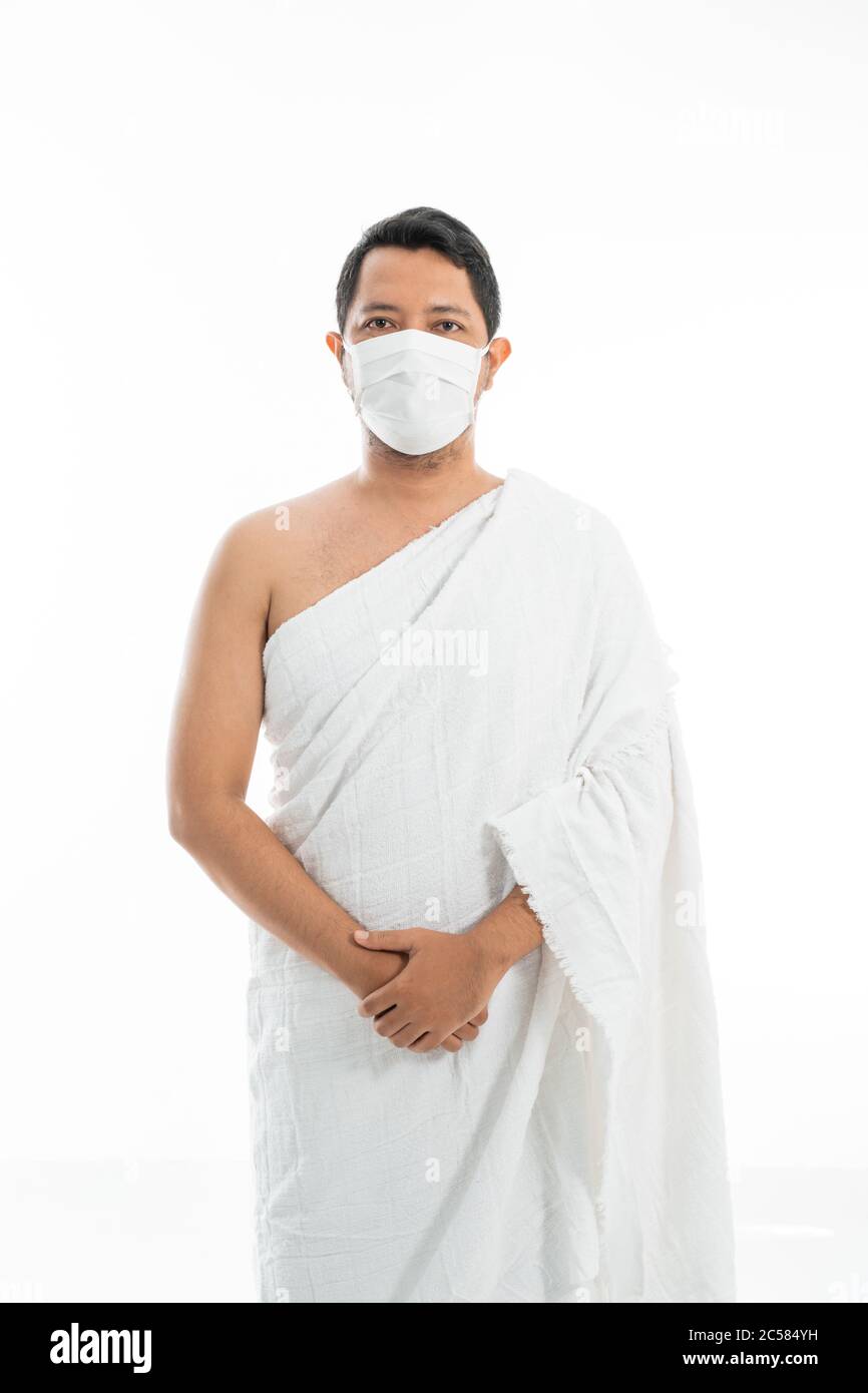 portrait of asian male umrah. muslim hajj wearing white ihram isolated ...