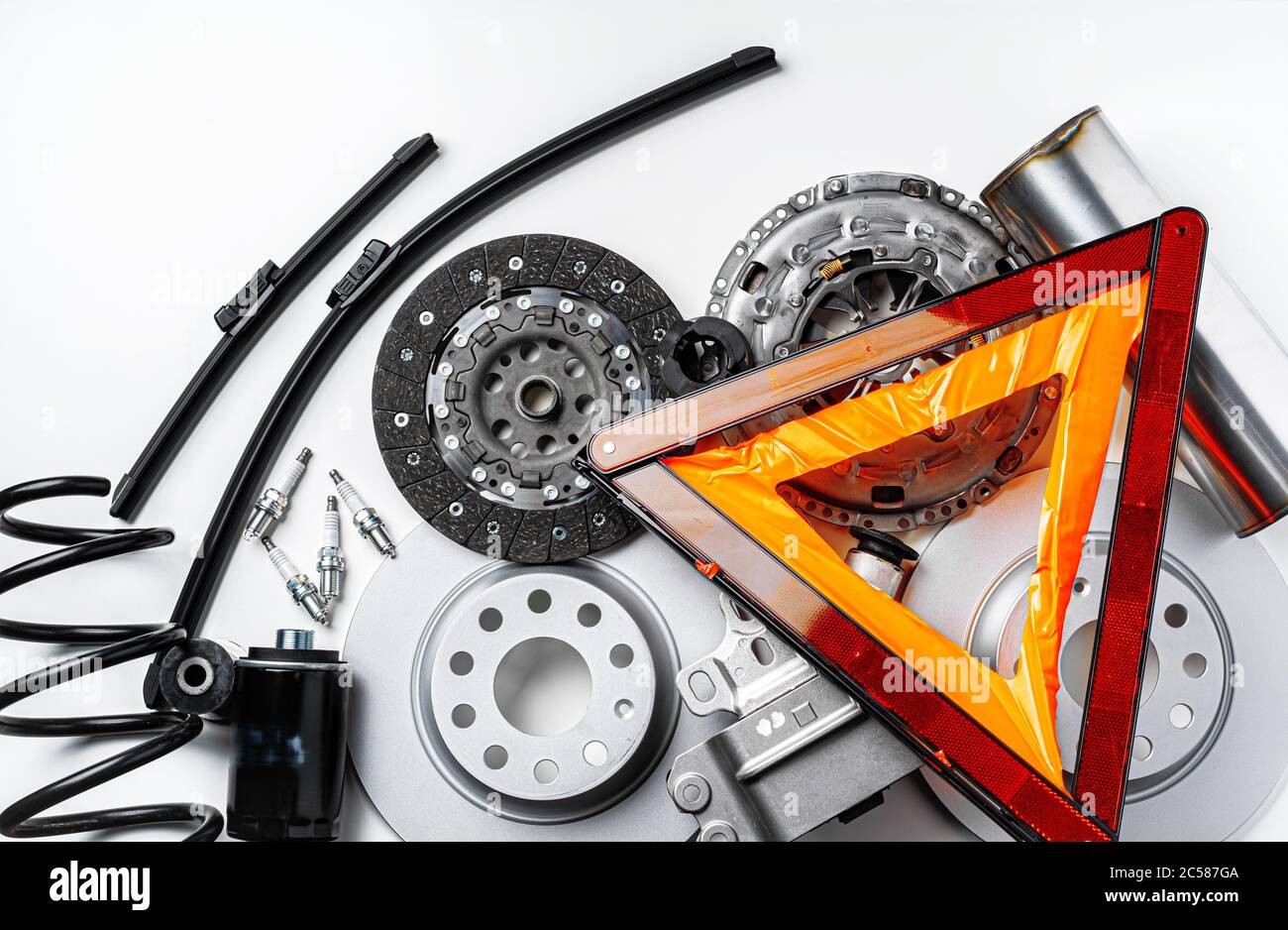 New metal auto parts on grey background Stock Photo - Alamy
