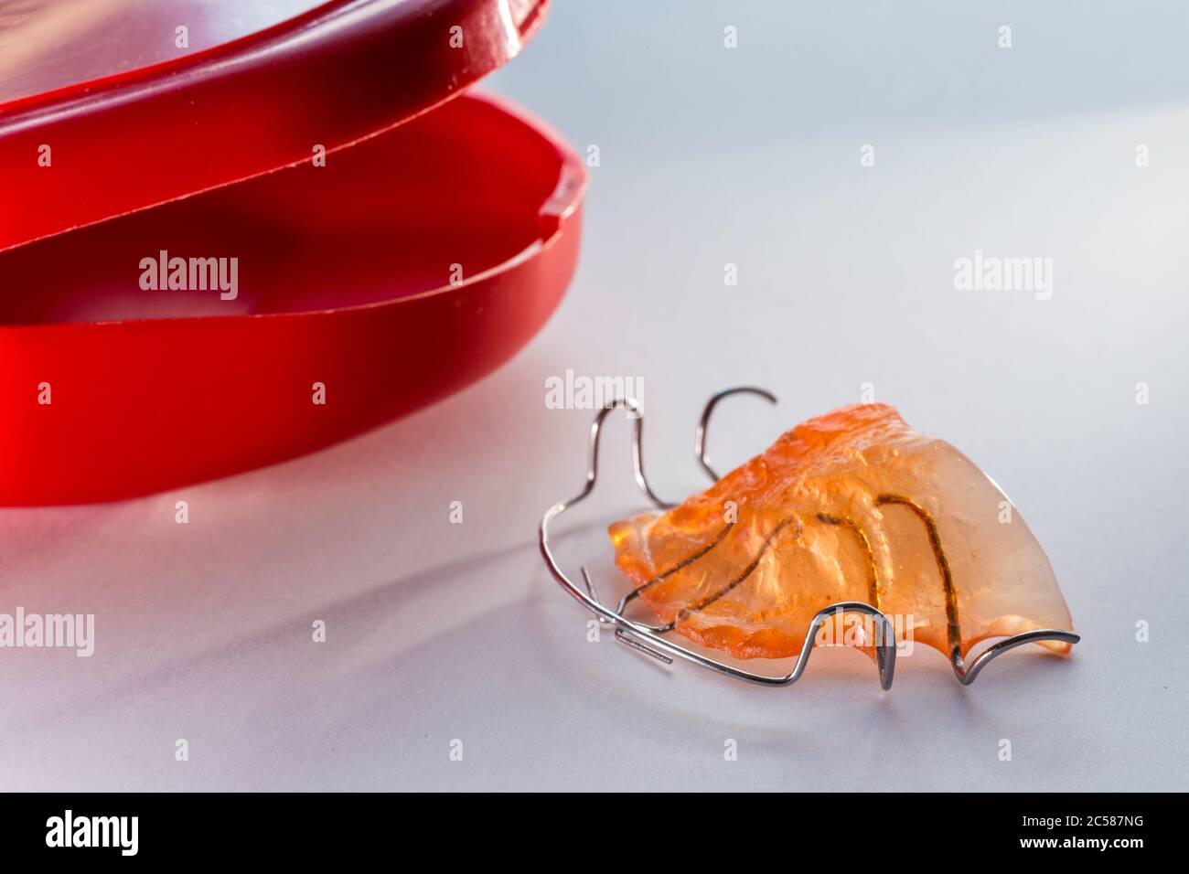 Hawley bow orthodontic teeth retainer still life Stock Photo - Alamy