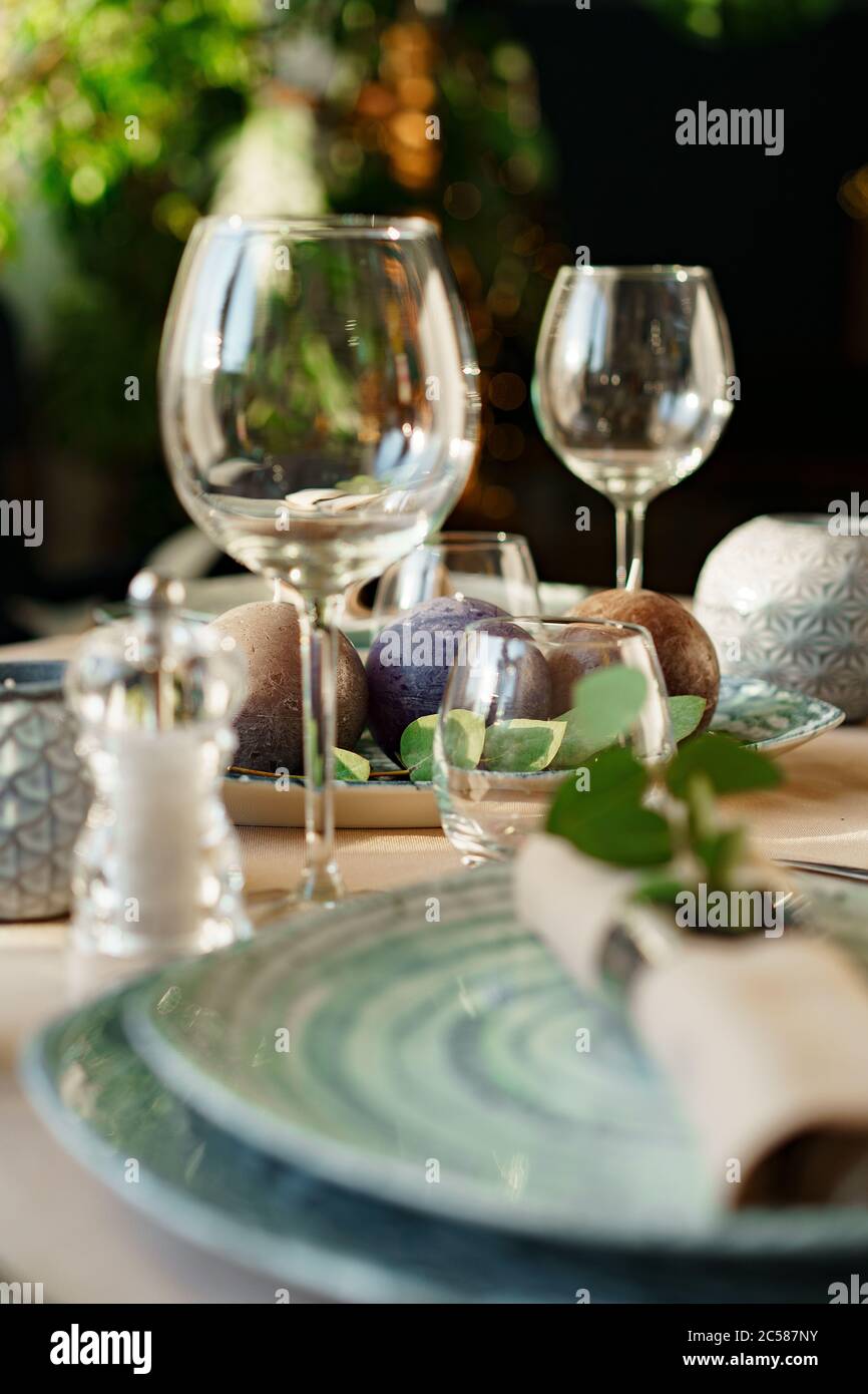 Luxury green table setting decorated with candles Stock Photo - Alamy