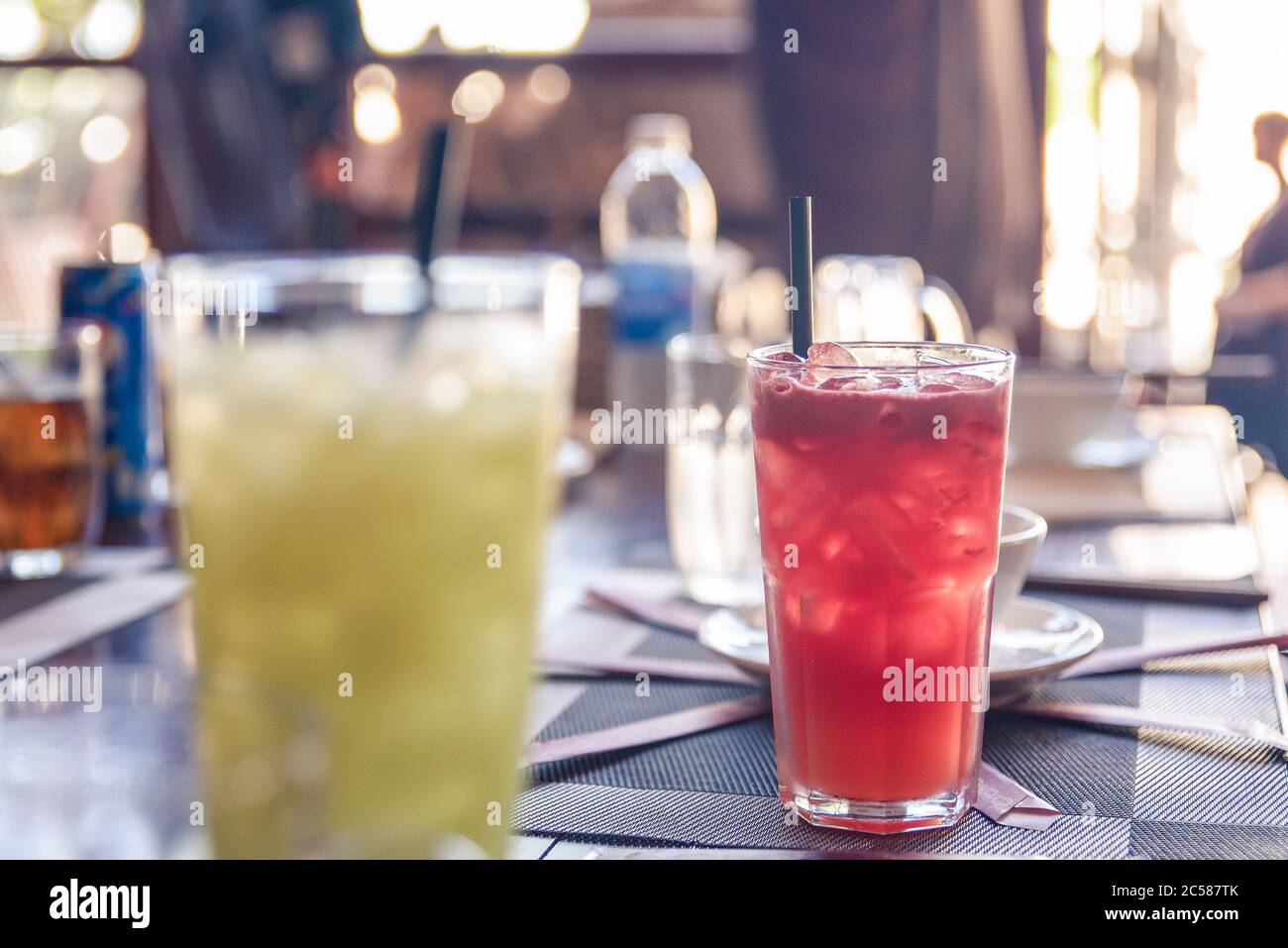 Fresh fruit juice with ice. Glass of watermelon juice on table in ...