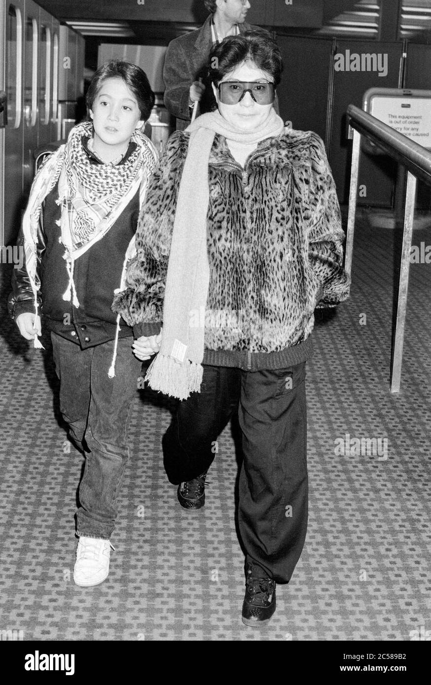 Japanese artist and former wife of Beatle John Lennon Yoko Ono with their son Sean leaving ...