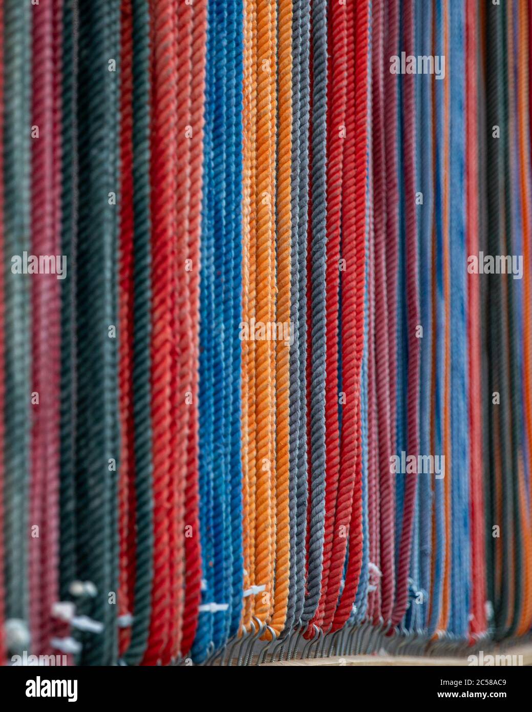 colorful ropes hanging on the wall Stock Photo - Alamy