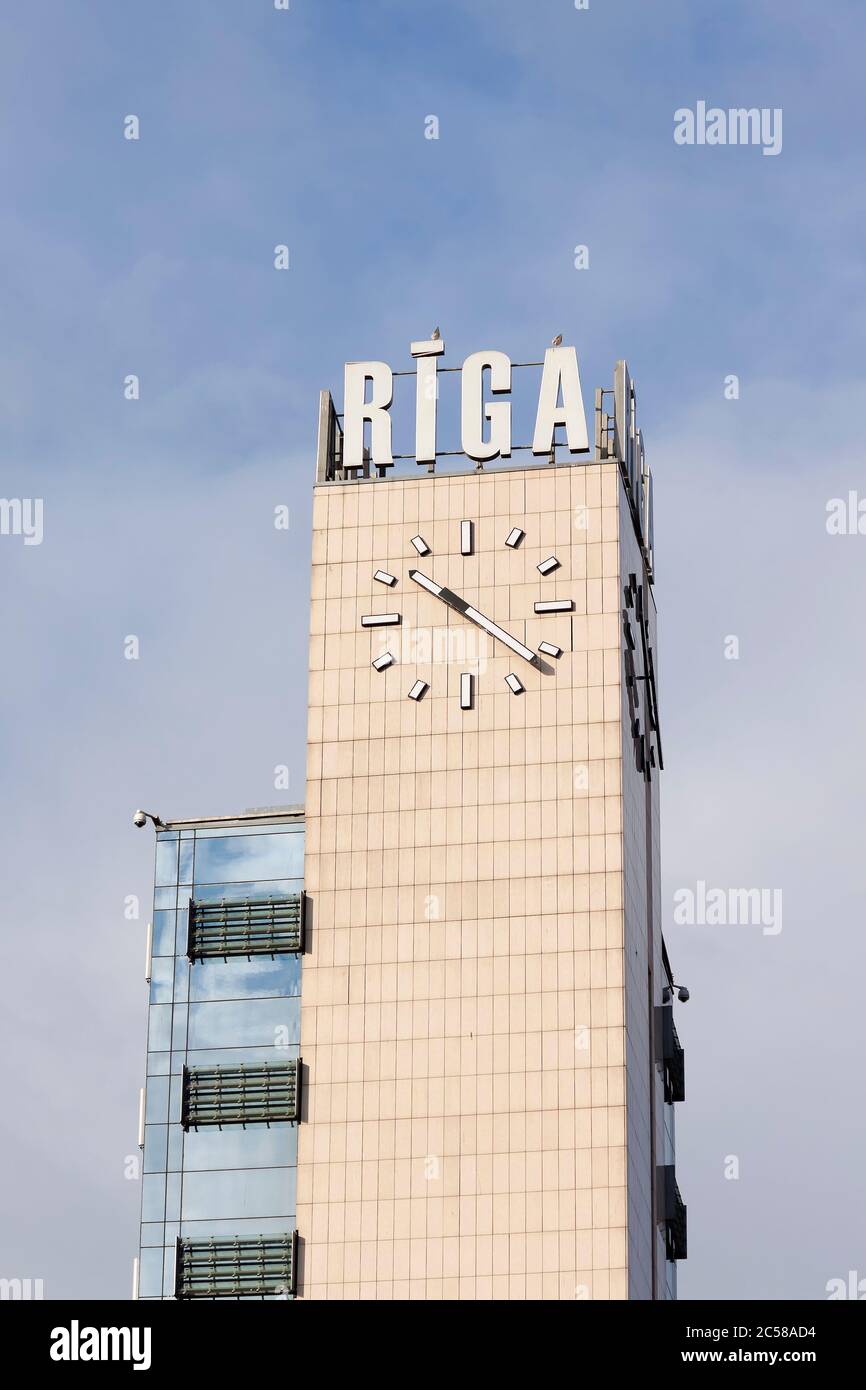 Caption Clock tower and logo at the Central Station, Rigas Centrala ...