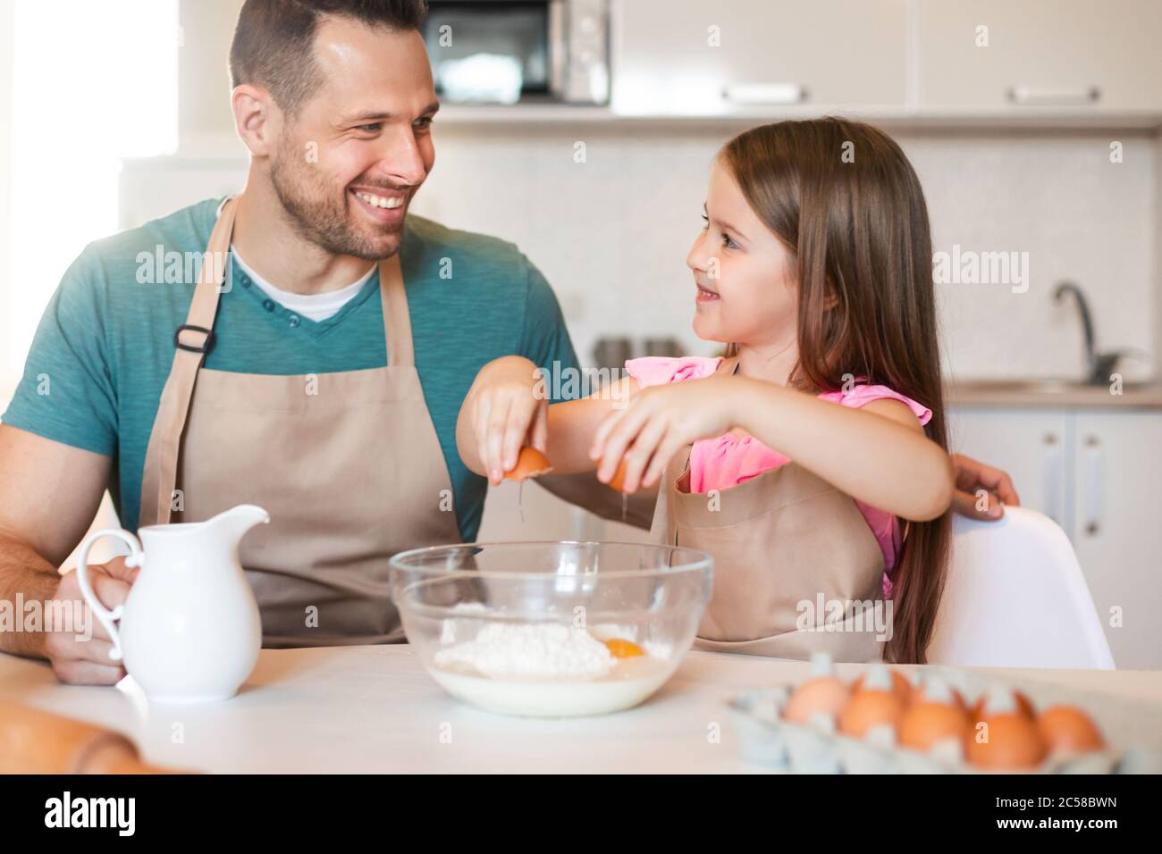 Cute Dad And Daughter Making Dough Baking Together At Home Stock Photo ...