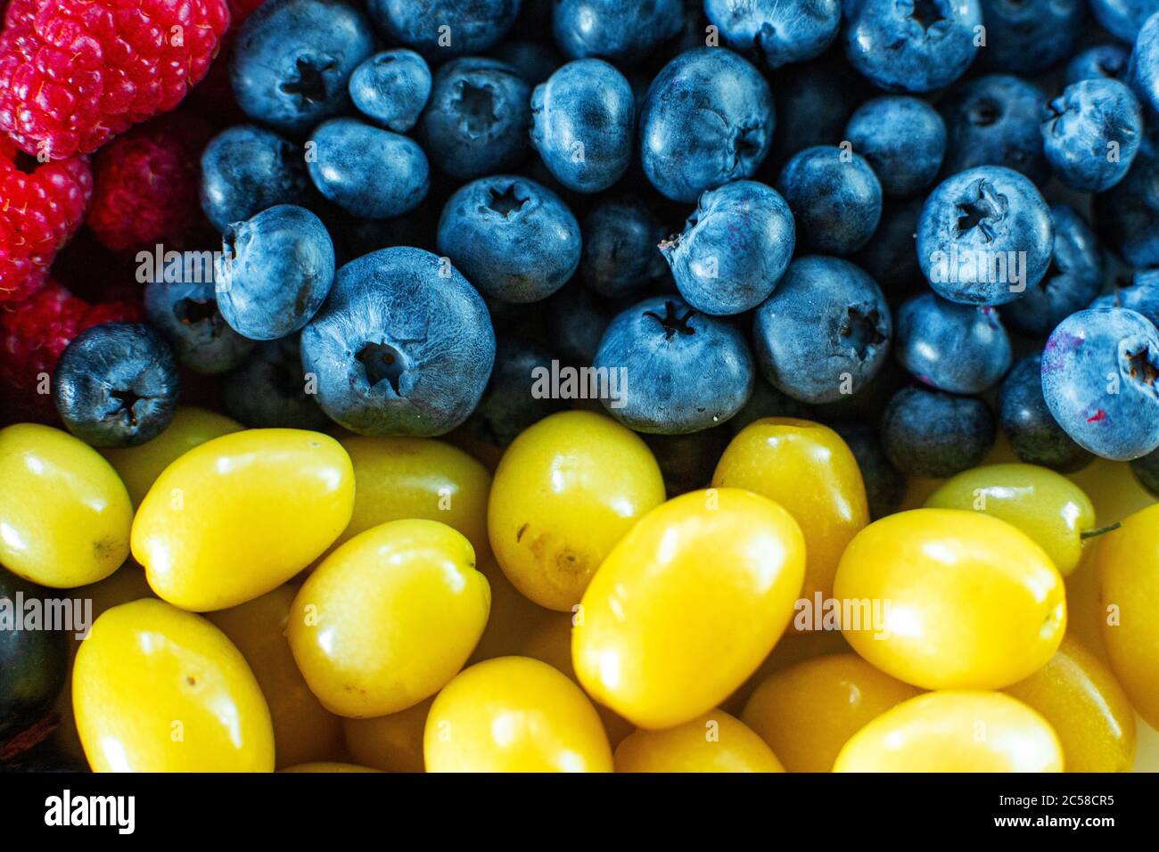 Mix of yellow and blue berries. Summer mick fruit. Berry layout Stock ...