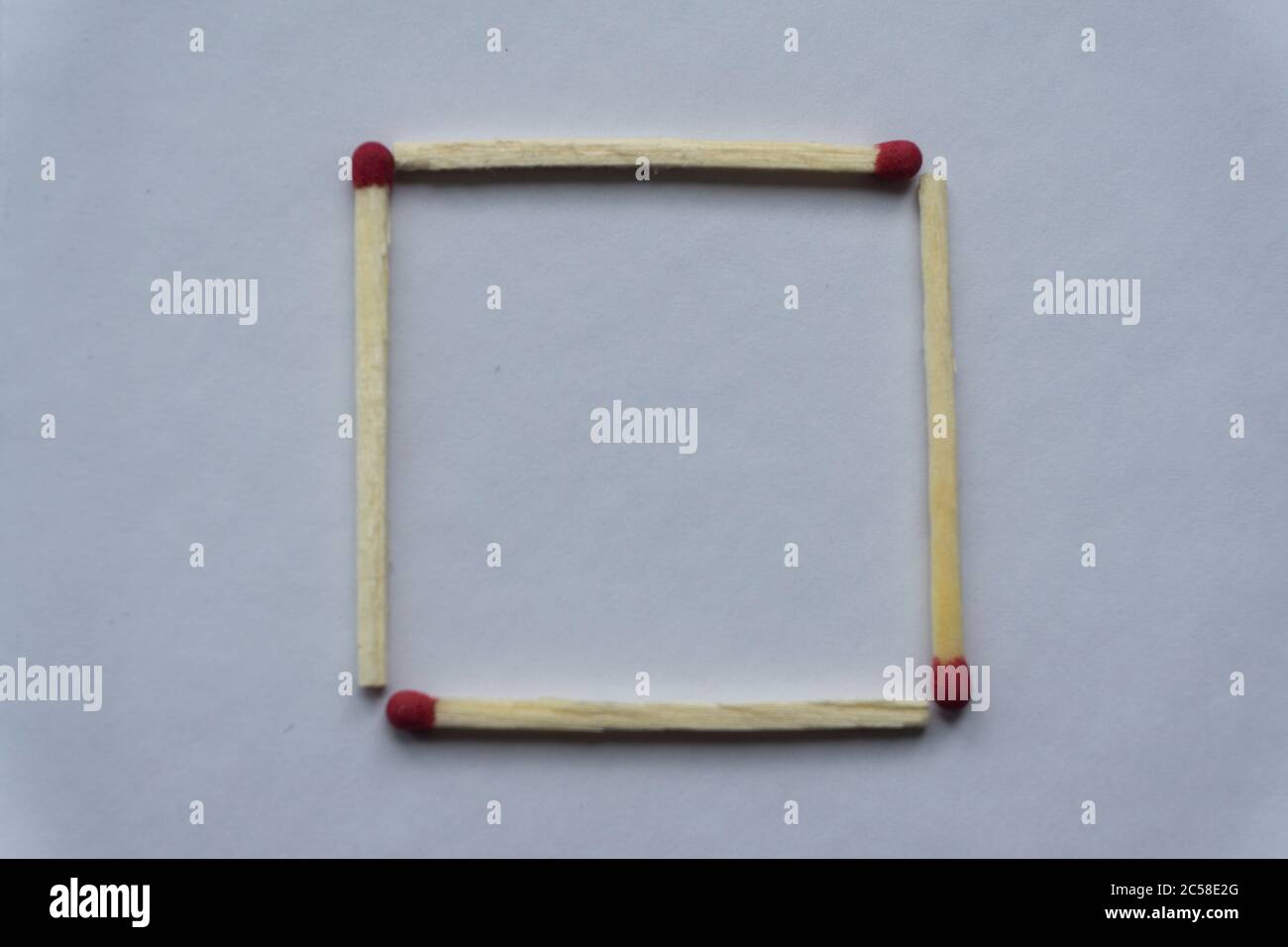 A square of matches on a white background. Top view. Mock up. Flat lay ...