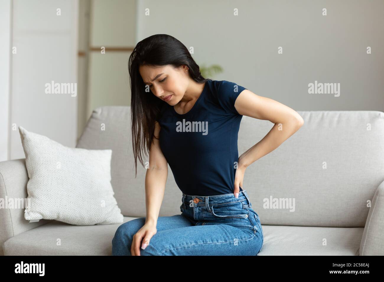 Backache back couch hi-res stock photography and images - Alamy
