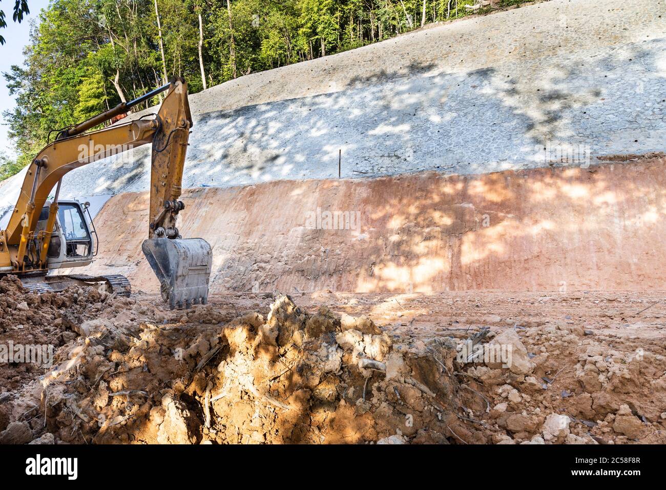 Slope retention construction work being carried out to manage landslide ...