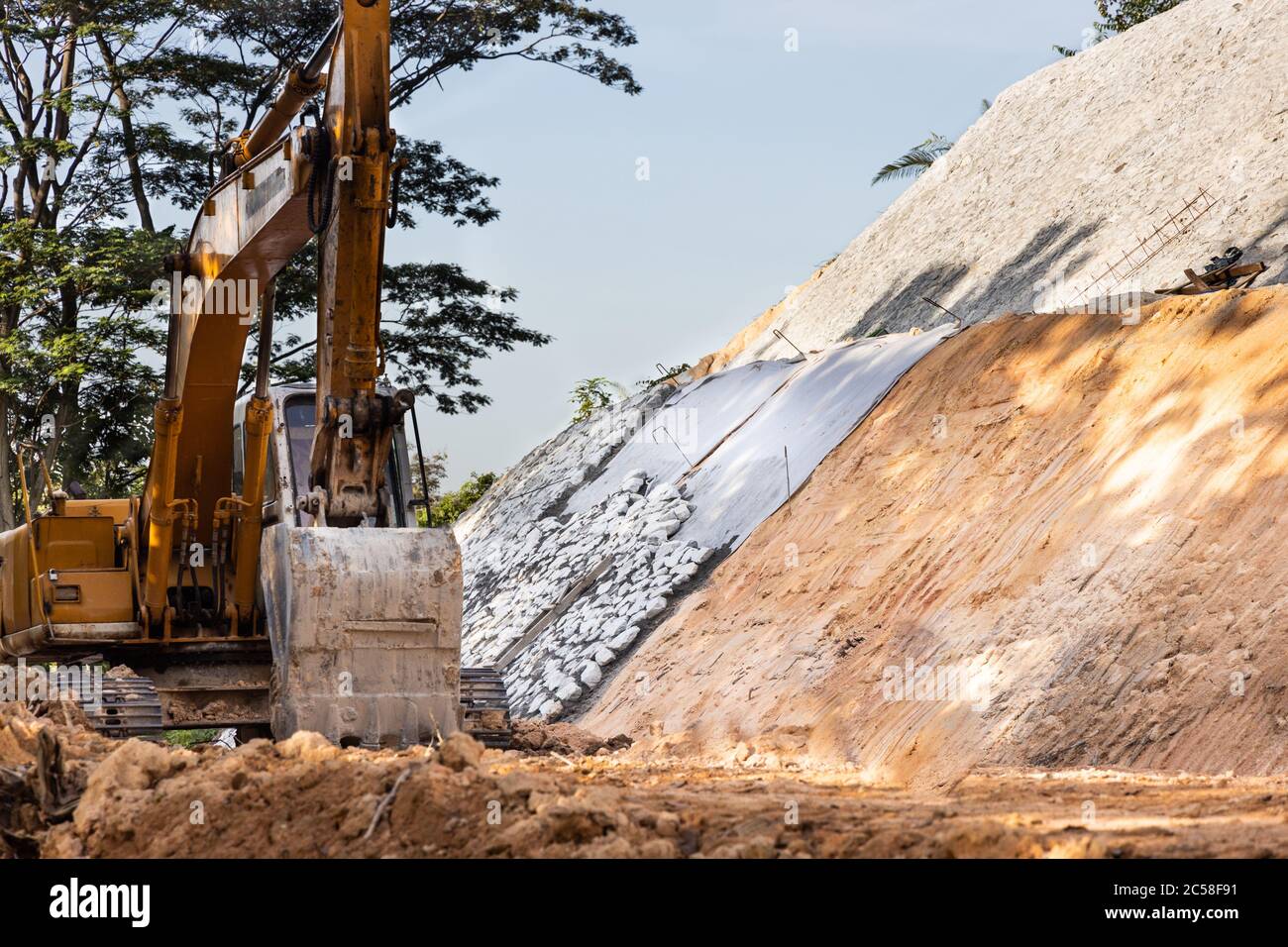 Slope retention construction work being carried out to manage landslide ...