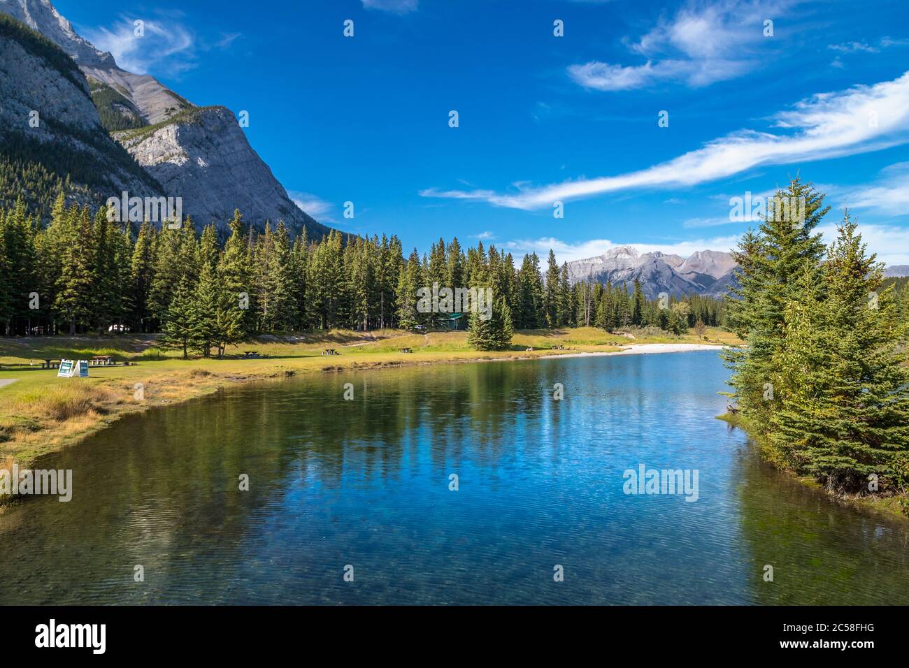 Breathtaking view of Cascade Mountain towering over Cascade Ponds with ...
