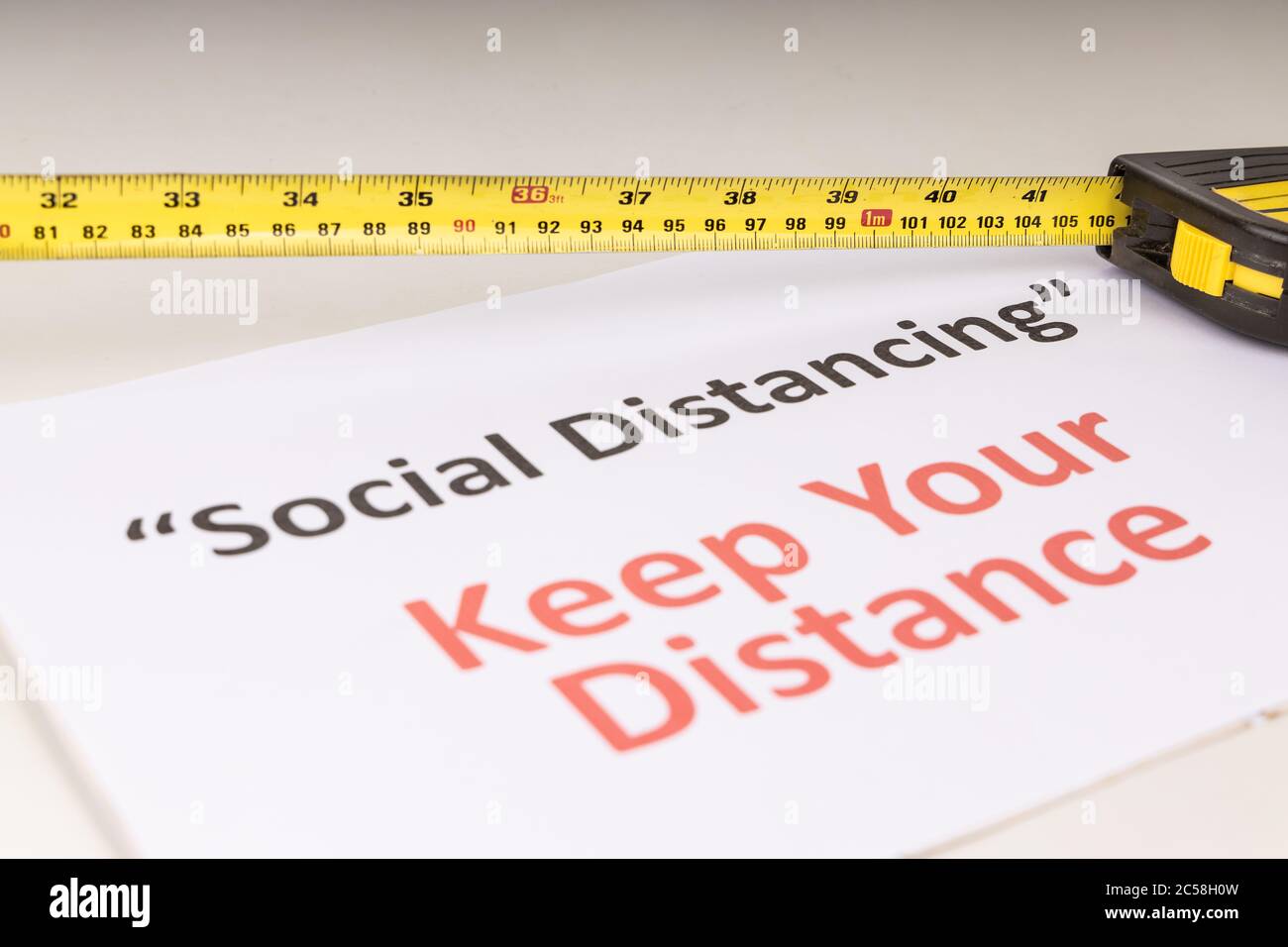 Social Distancing concept with measuring tape focused on 1 meter mark ...