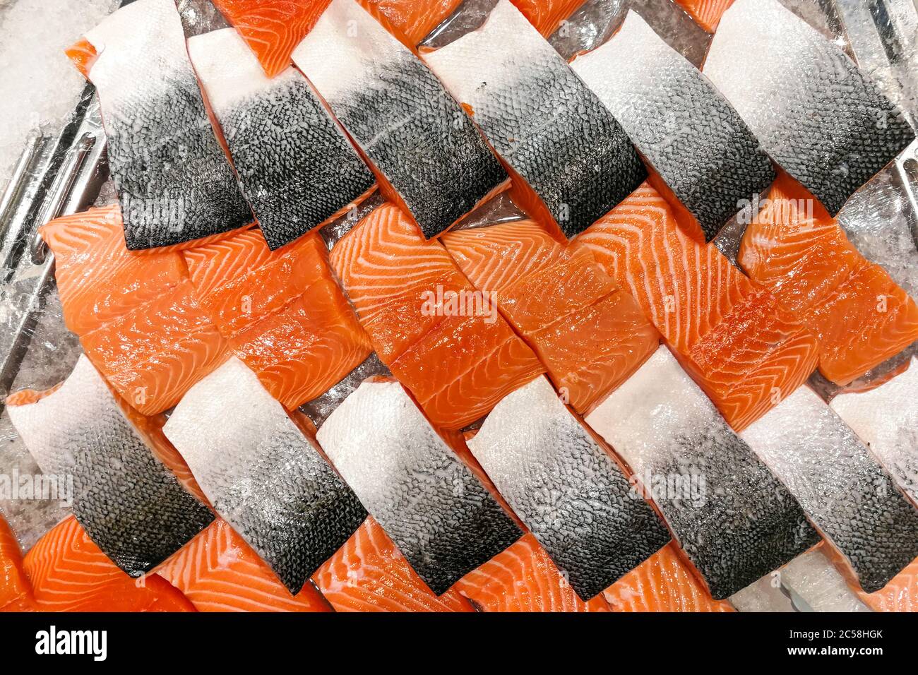Blocks of fresh raw salmon fillet display for sale in supermarket Stock ...