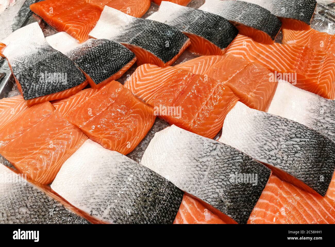Blocks of fresh raw salmon fillet display for sale in supermarket Stock ...