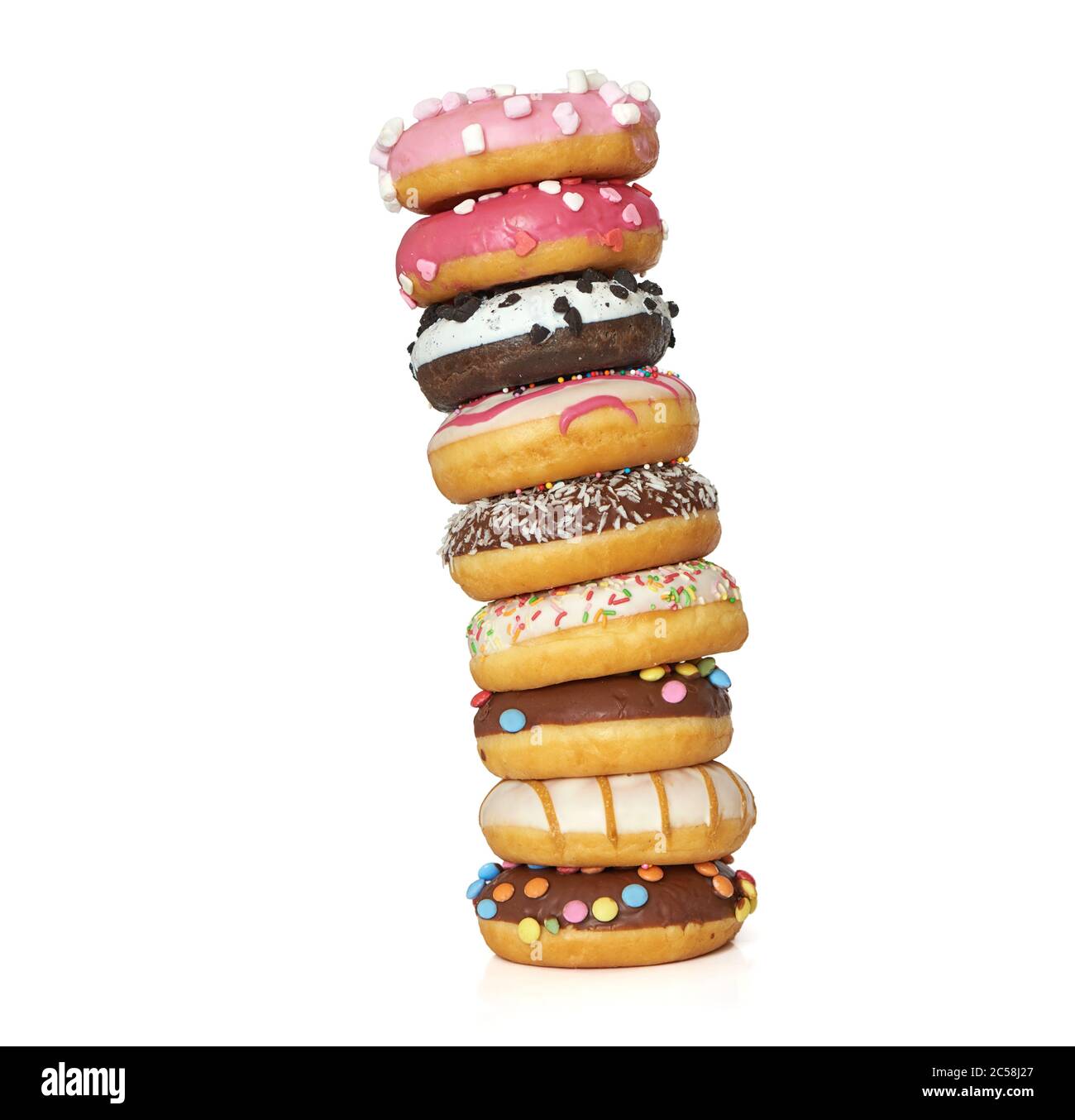 Stack of glazed doughnut with sprinkles on white background. Copy space ...