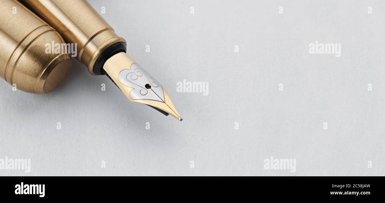 Golden Fountain Pen on a white background with copy space Stock Photo ...
