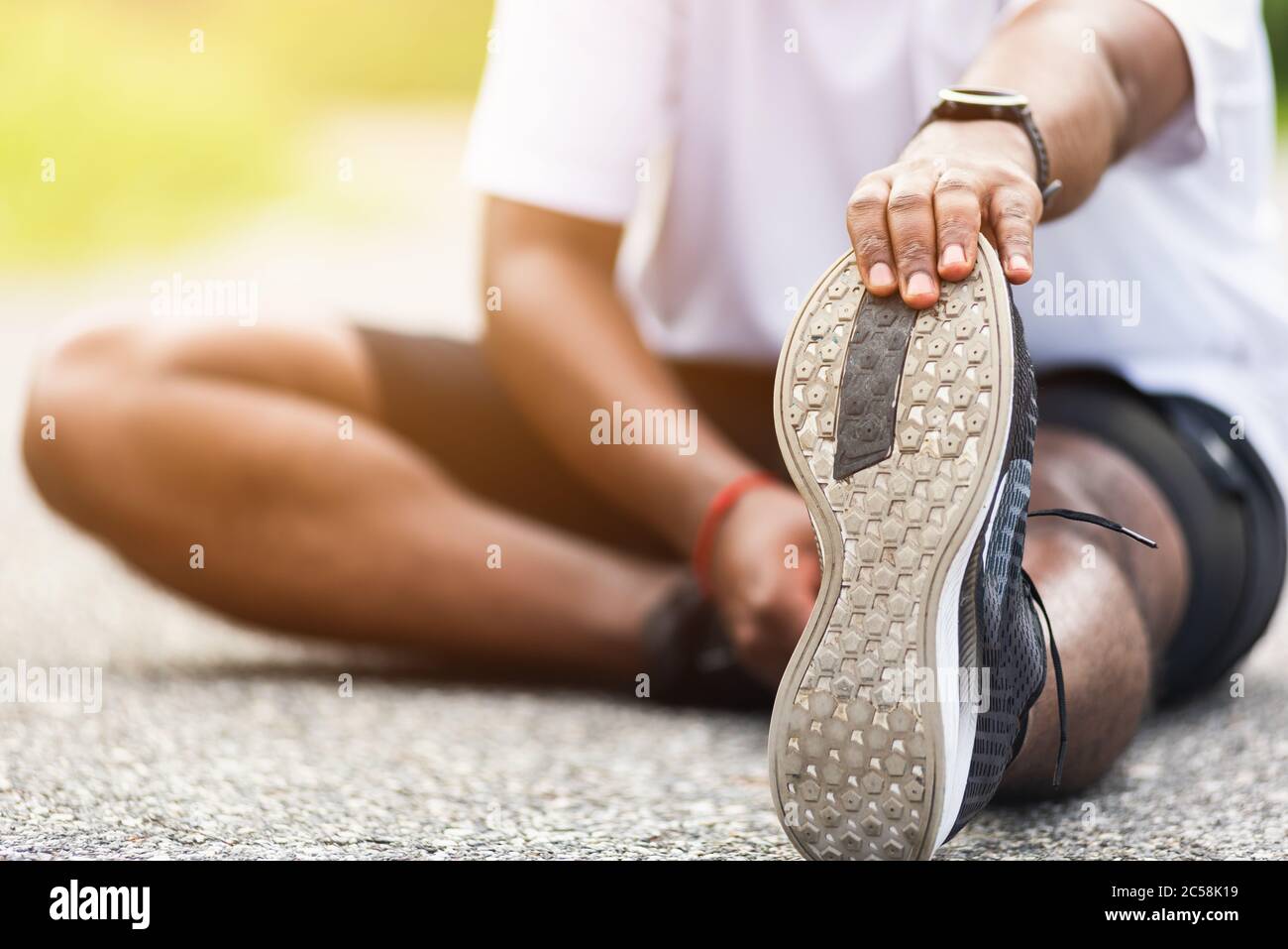 Close up Asian young athlete sport runner black man wear watch he ...